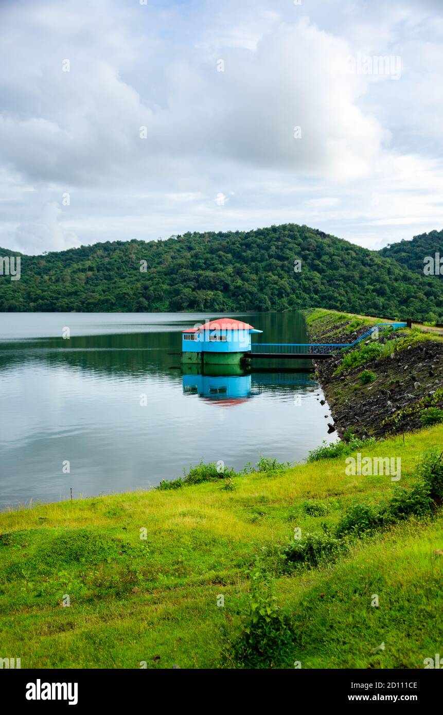 Serene view of Chapoli dam reservoir during monsoon season in Canacona ...