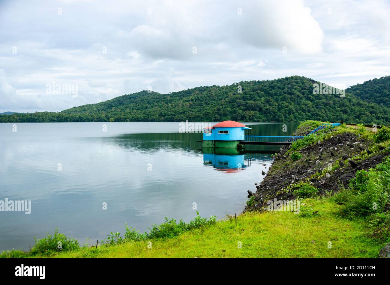 Serene view of Chapoli dam reservoir during monsoon season in Canacona ...