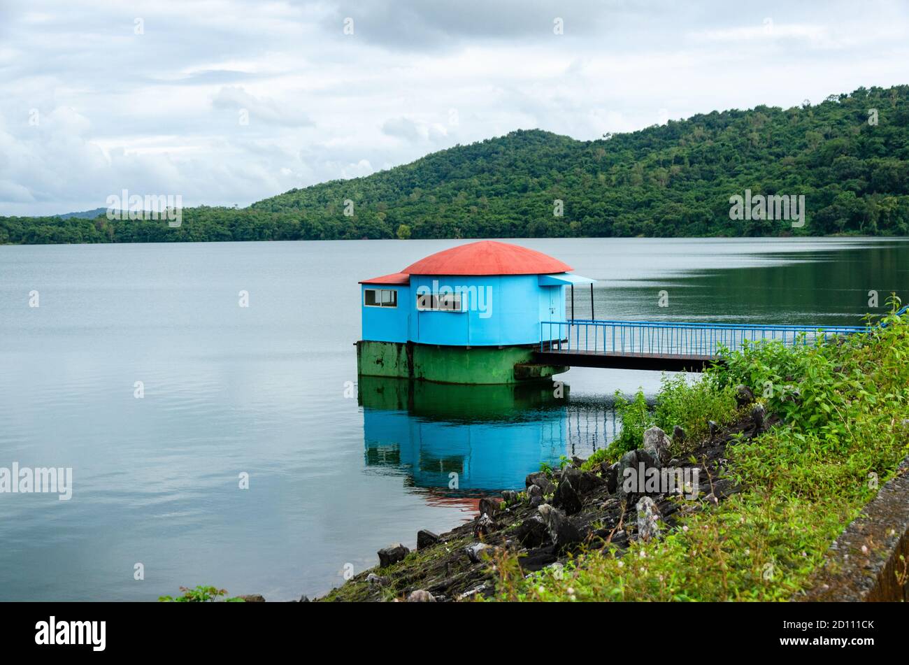 Serene view of Chapoli dam reservoir during monsoon season in Canacona ...