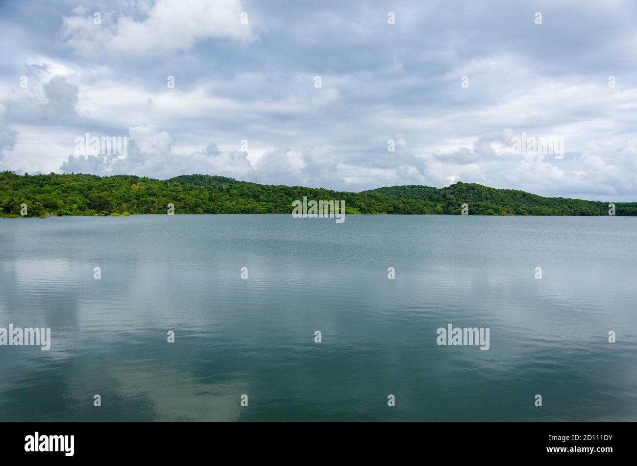 Serene view of Chapoli dam reservoir during monsoon season in Canacona ...