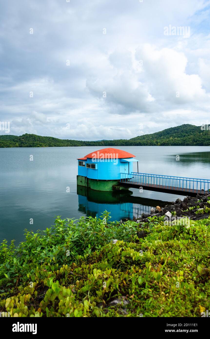 Serene view of Chapoli dam reservoir during monsoon season in Canacona ...