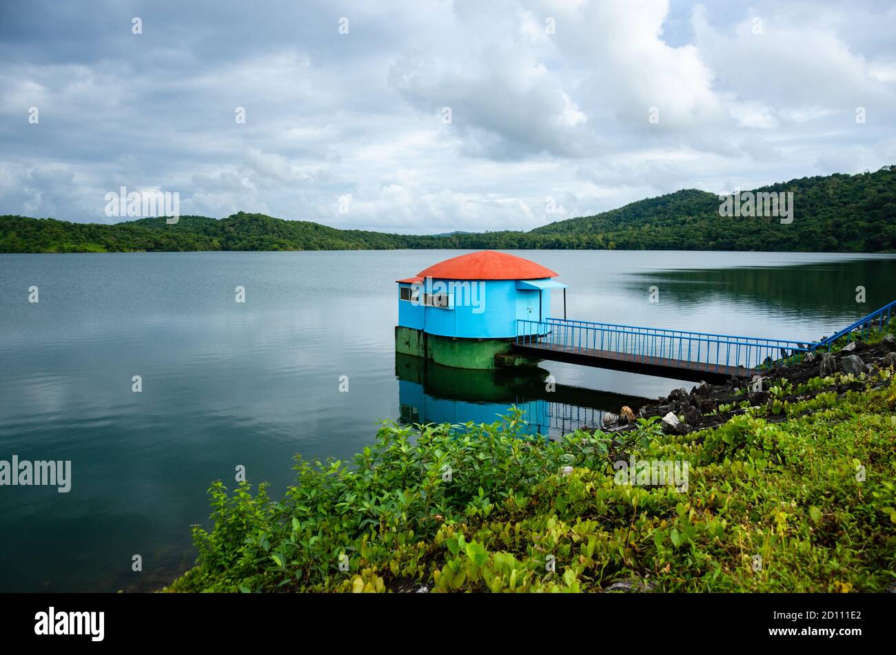 Serene view of Chapoli dam reservoir during monsoon season in Canacona ...