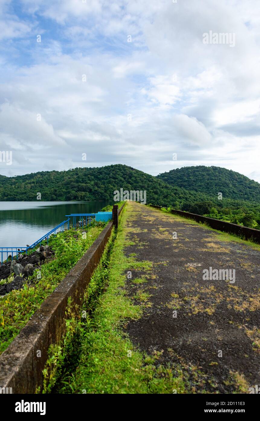 Serene view of Chapoli dam reservoir during monsoon season in Canacona ...