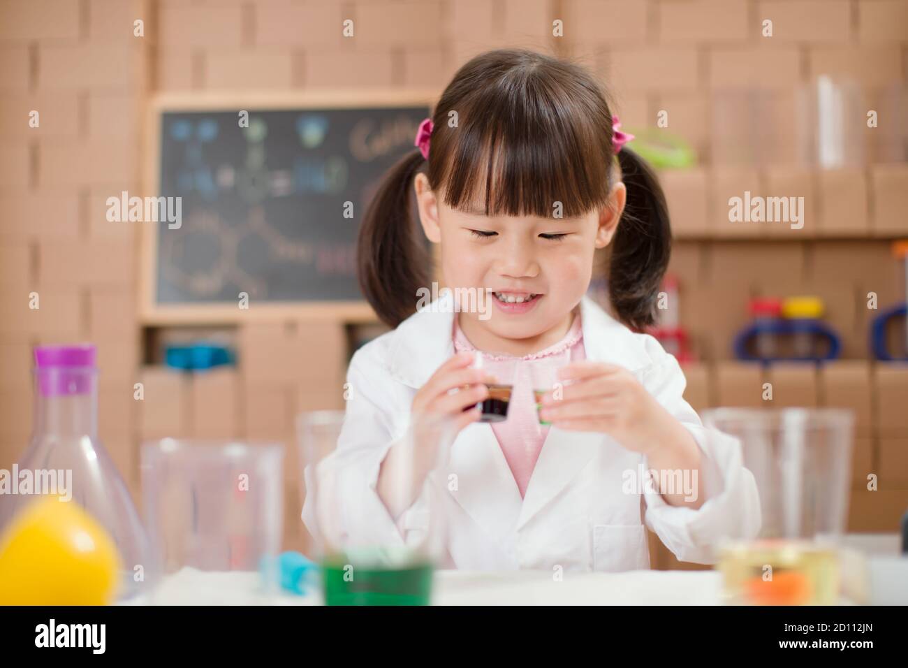 young girl play science experiments for homeschooling Stock Photo - Alamy
