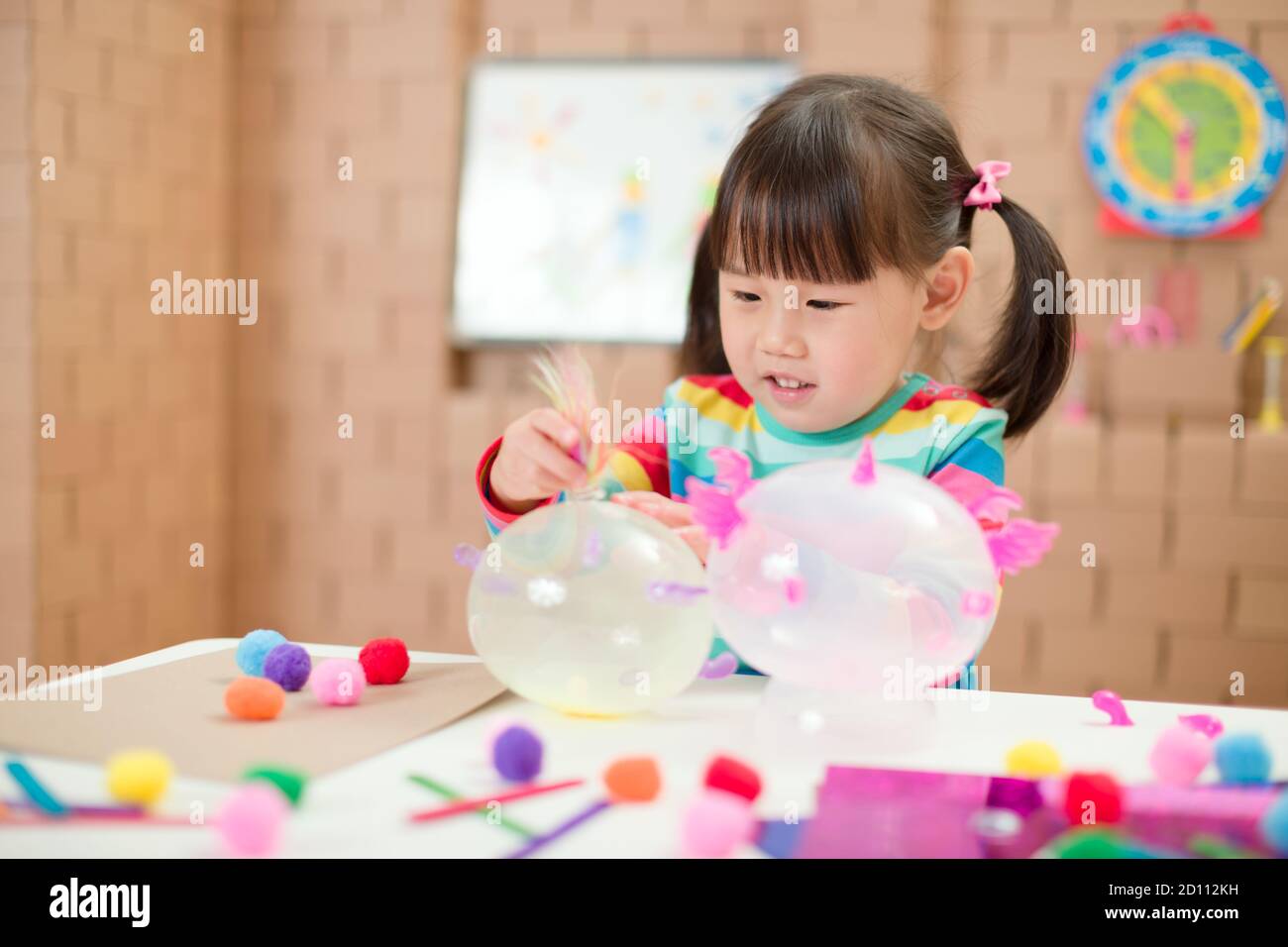 young girl making craft for homeschooling Stock Photo - Alamy