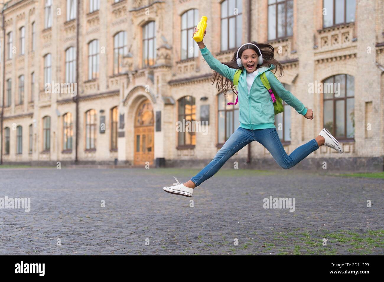 jumping happy child feel freedom and joy with water bottle outdoor ...