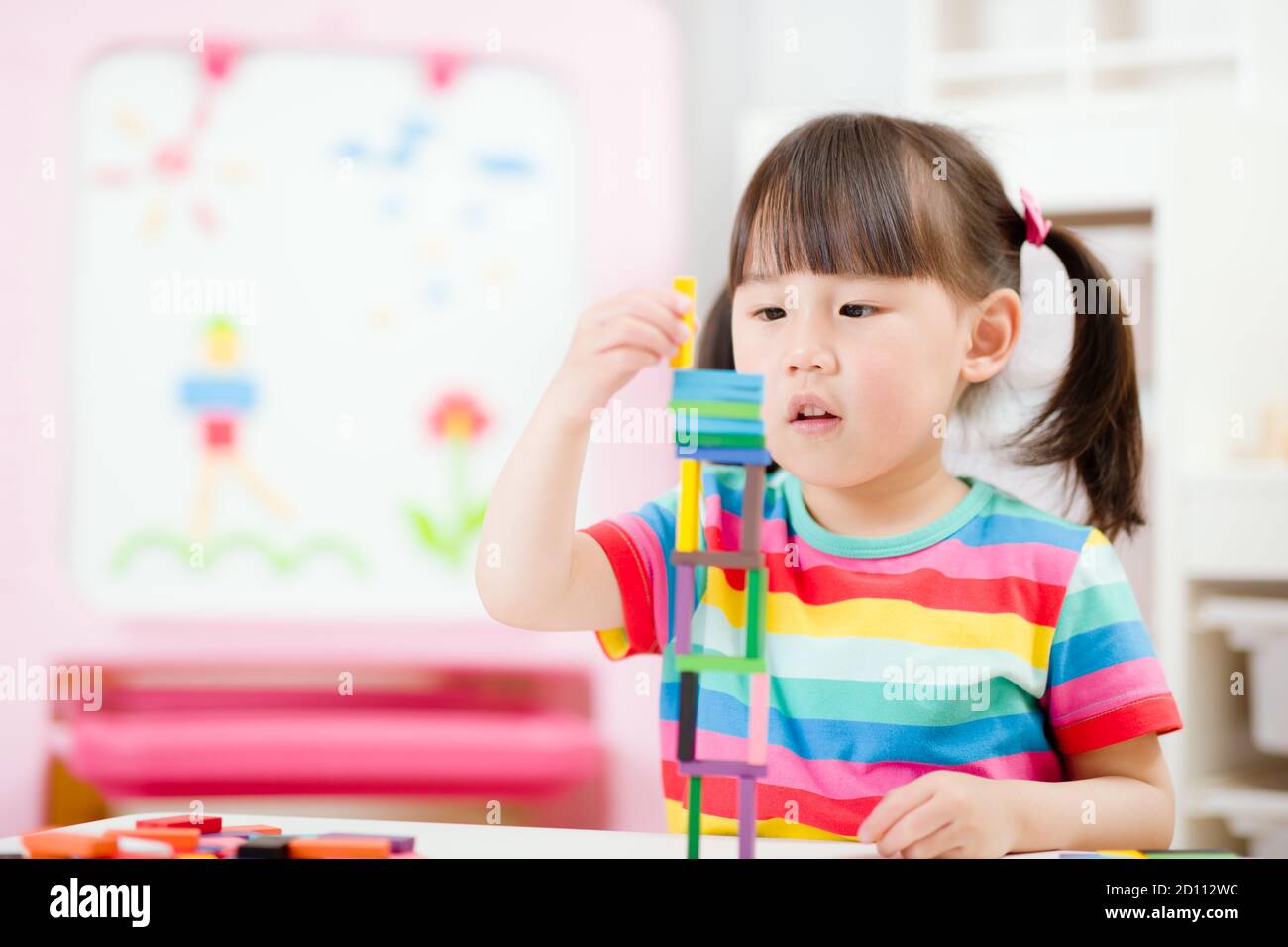 young girl play number sticks fine motor skill game for homeschooling ...