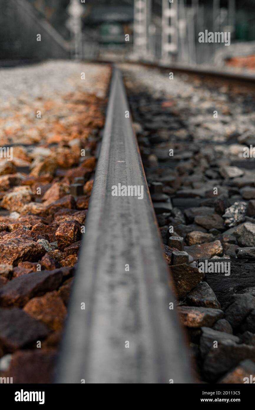 Vertical shot of an old rusty railroad track on ballast Stock Photo - Alamy