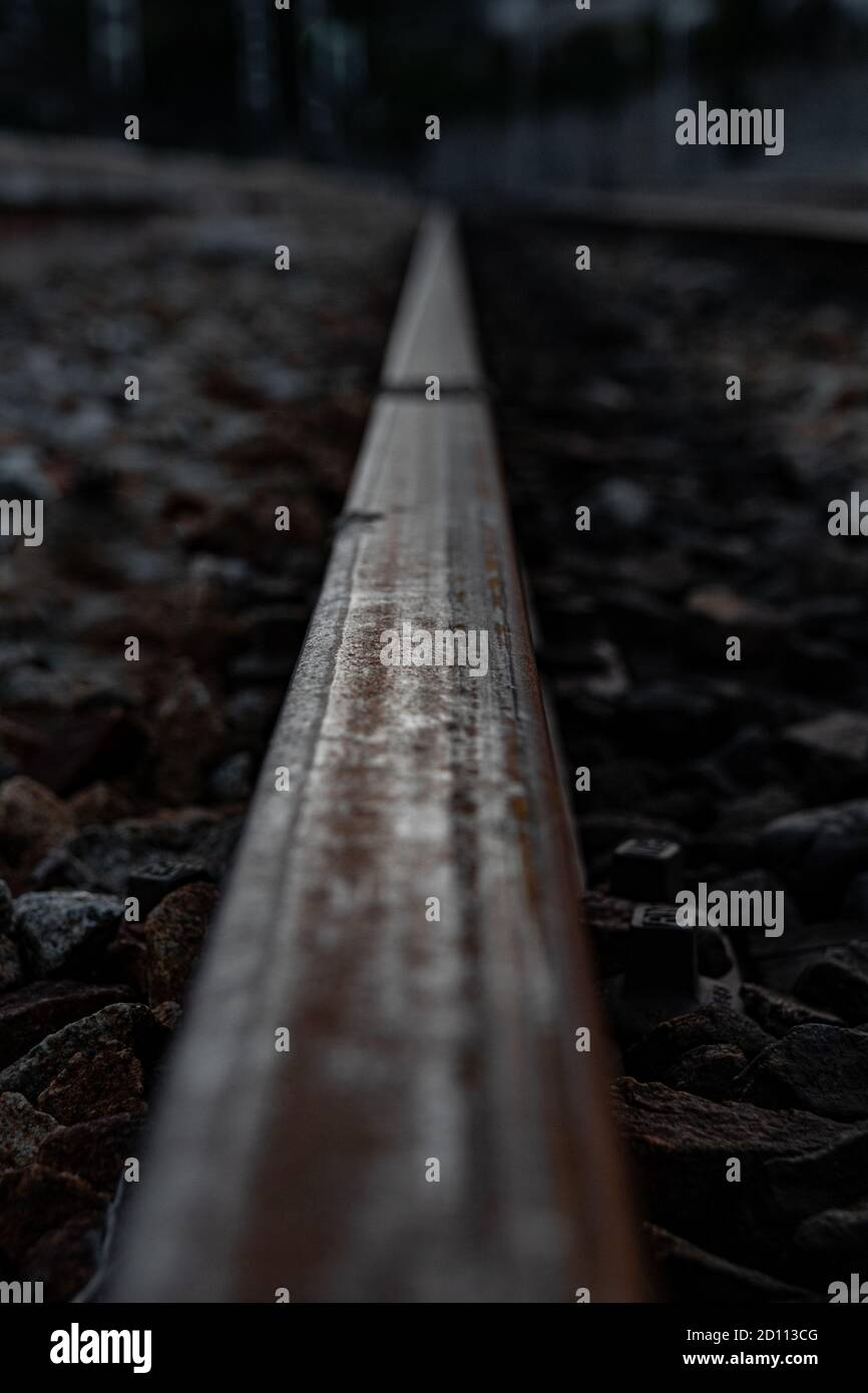 Vertical shot of an old rusty railroad track on ballast Stock Photo - Alamy