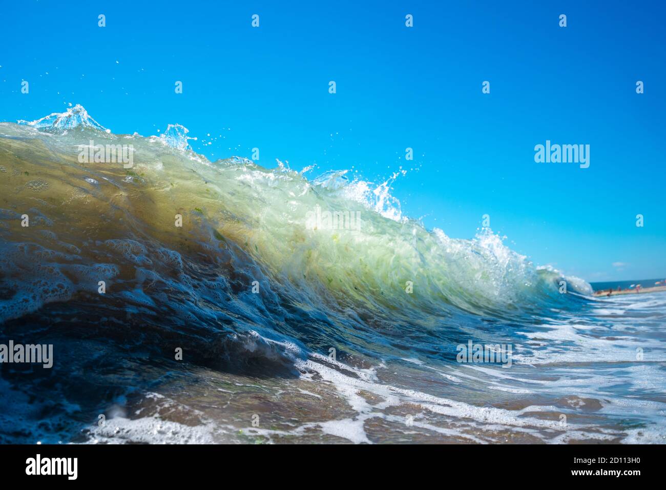 Sea wave close up, low angle view, sunrsie shot Stock Photo - Alamy