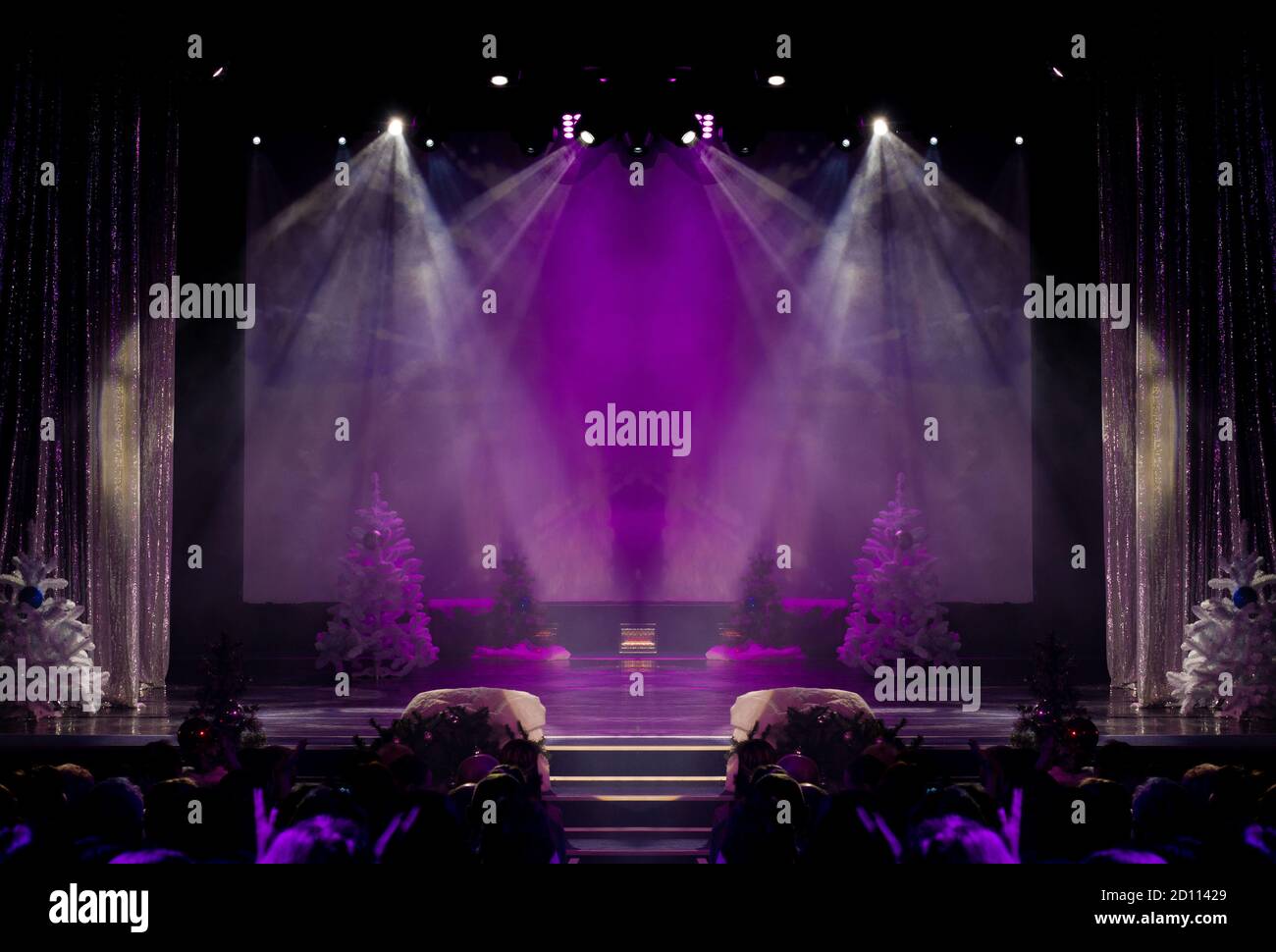 An empty stage of the theater, lit by spotlights and smoke before the ...