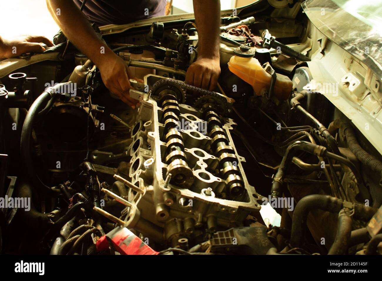 repair personal car engine, open up engine in automotive service center ...