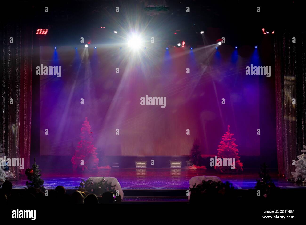 An empty stage of the theater, lit by spotlights and smoke before the ...