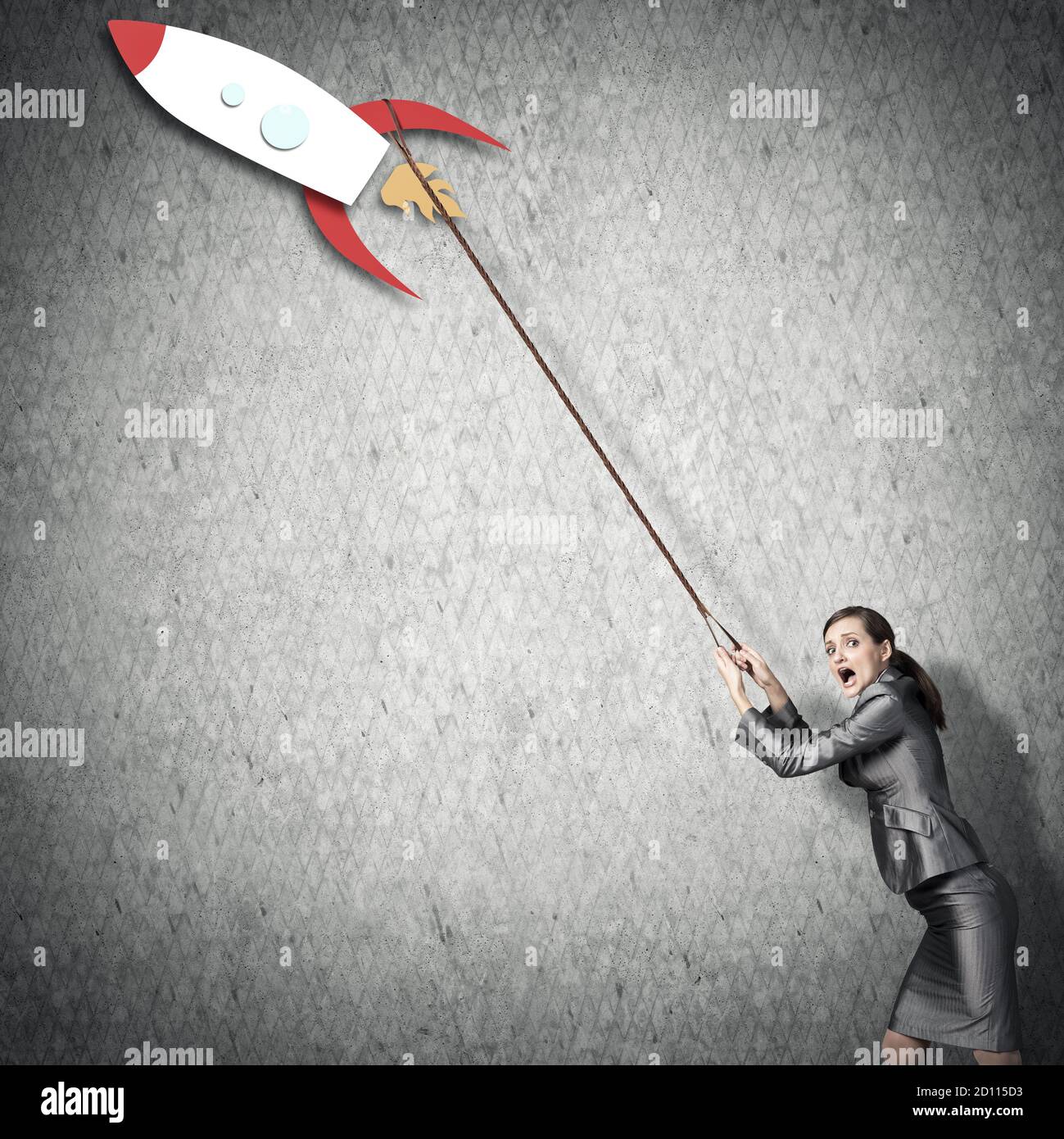 Woman catch rocket Stock Photo - Alamy