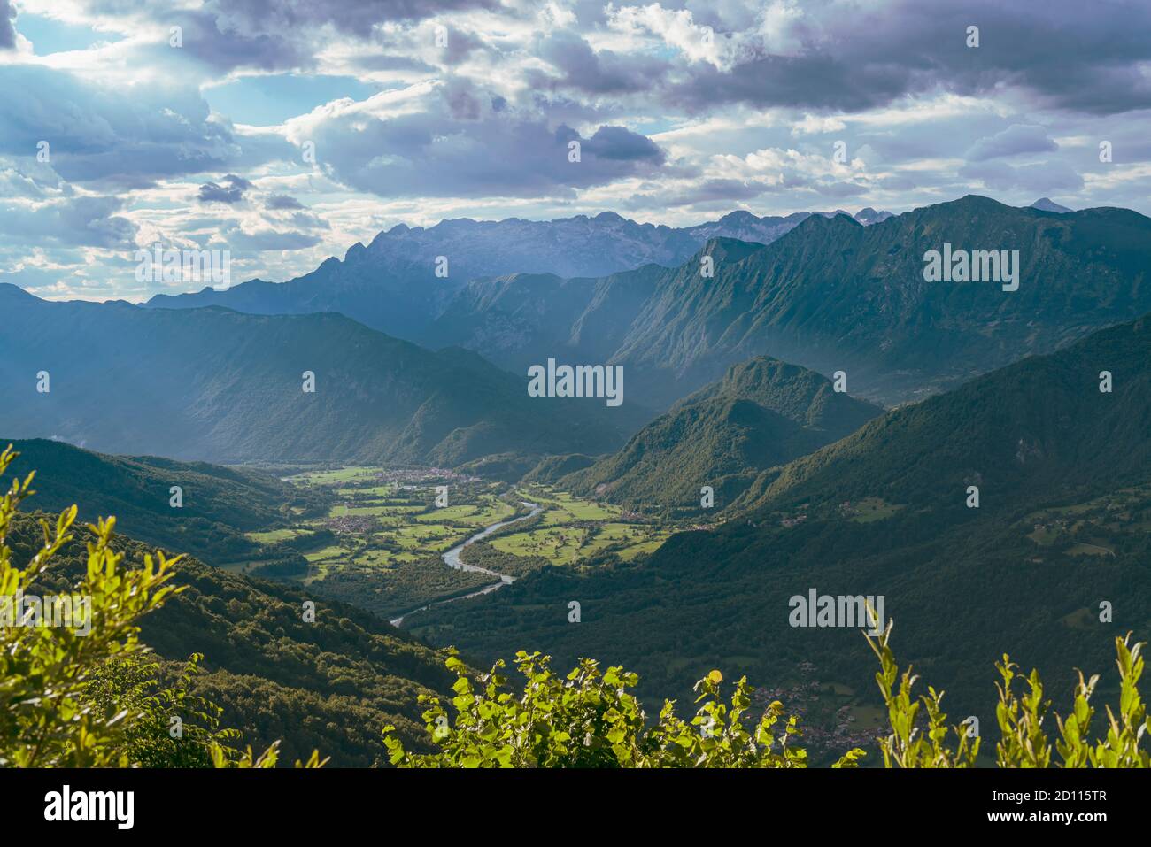 Autumn evening in the Soca valley. Green meadows surrounded by high ...