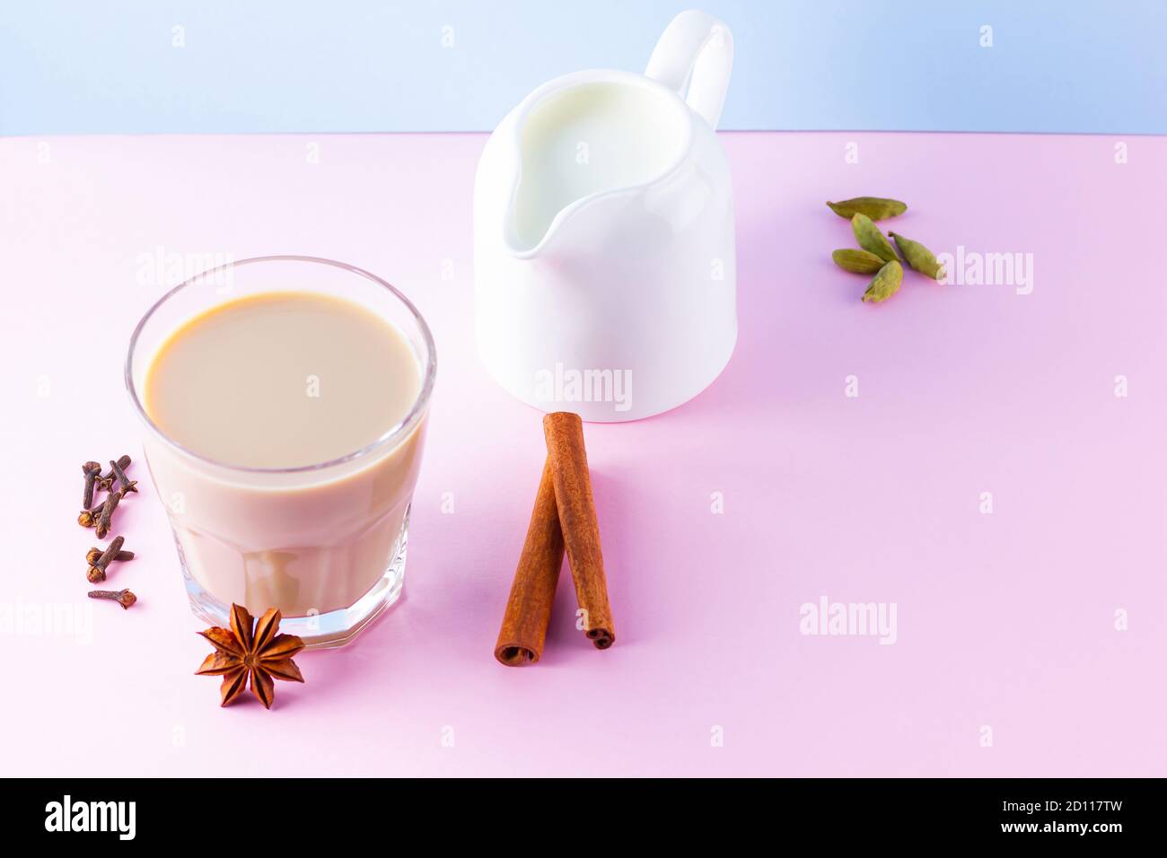 Masala tea and spices on a pink blue background. Masala chai in glass ...