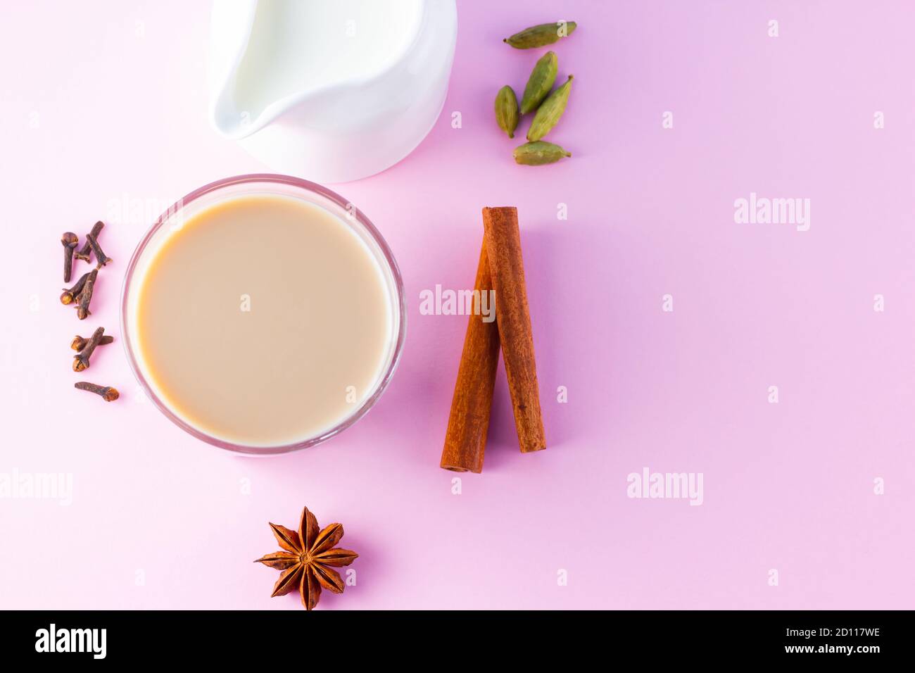 Masala tea and spices on a pink background. Masala chai in glass ...