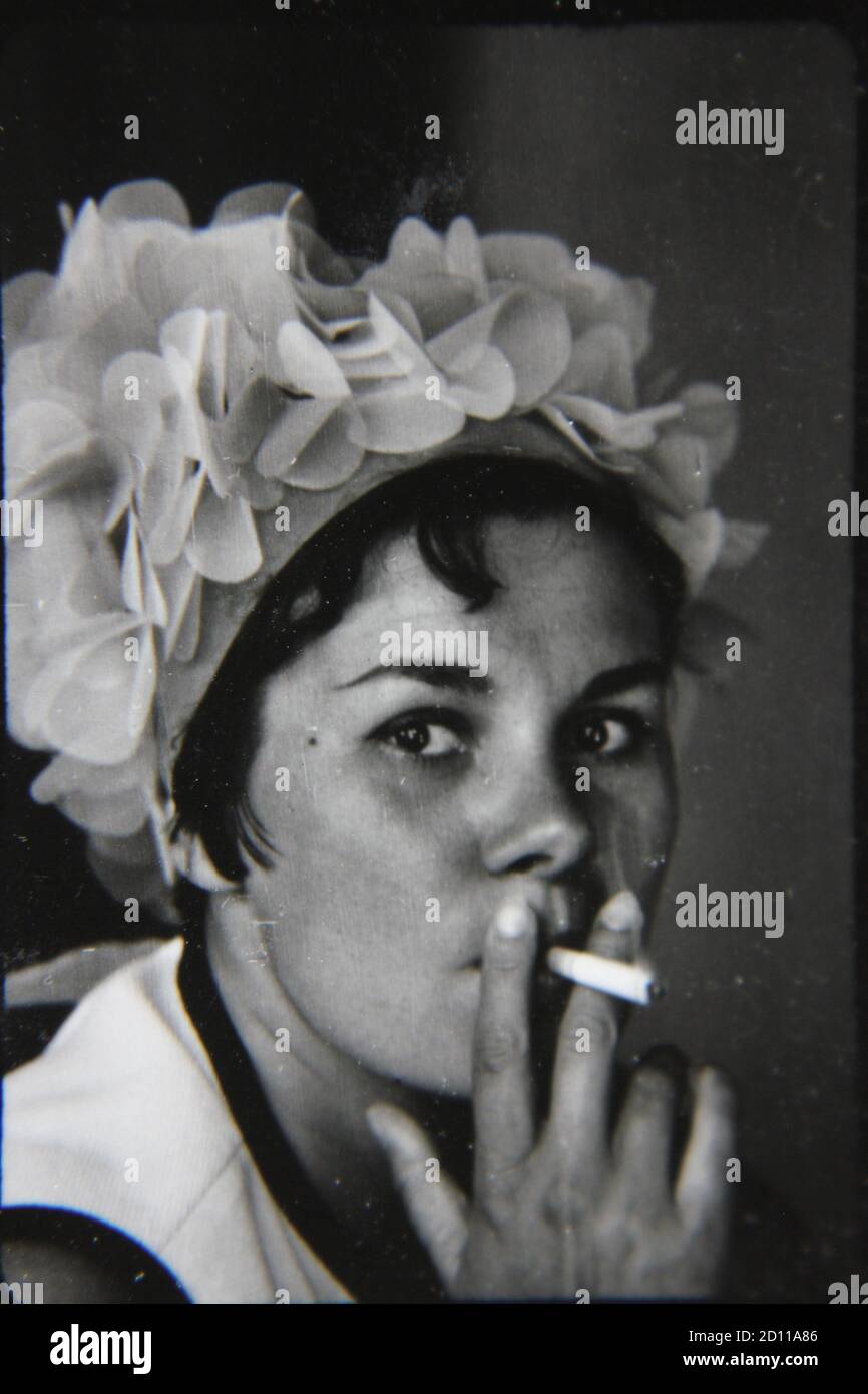 Fine 1970s black and white photography of a woman smoking and inhaling ...