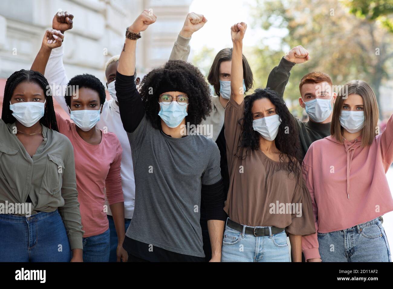 Group of people wearing face mask protesting and giving slogans Stock ...