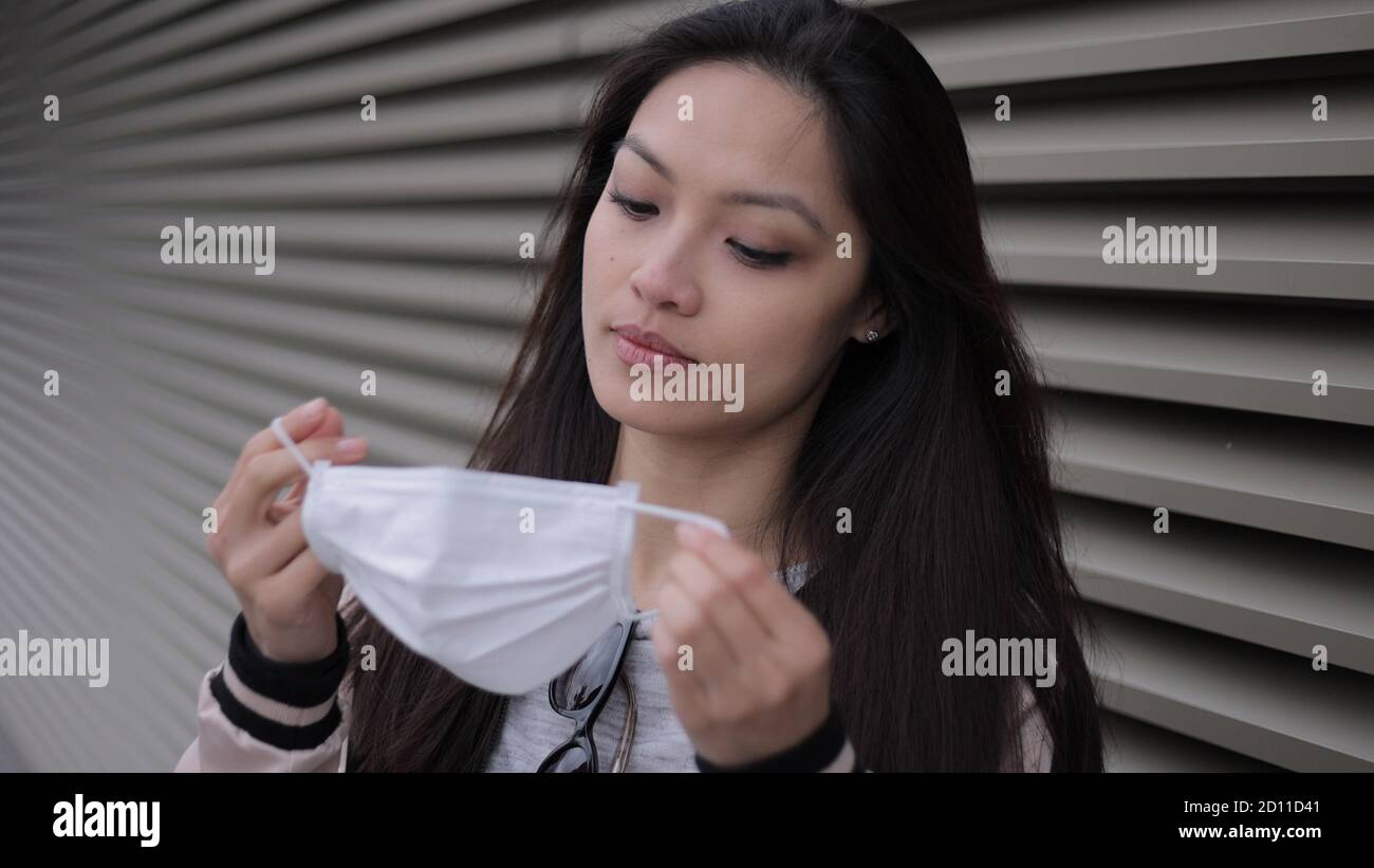 Putting on face mask due hi-res stock photography and images - Alamy