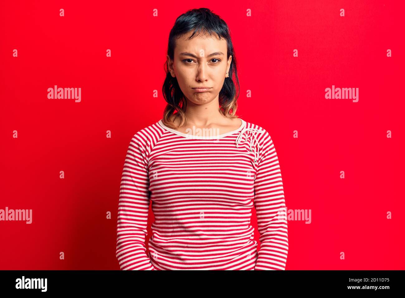 Young woman wearing casual clothes depressed and worry for distress ...