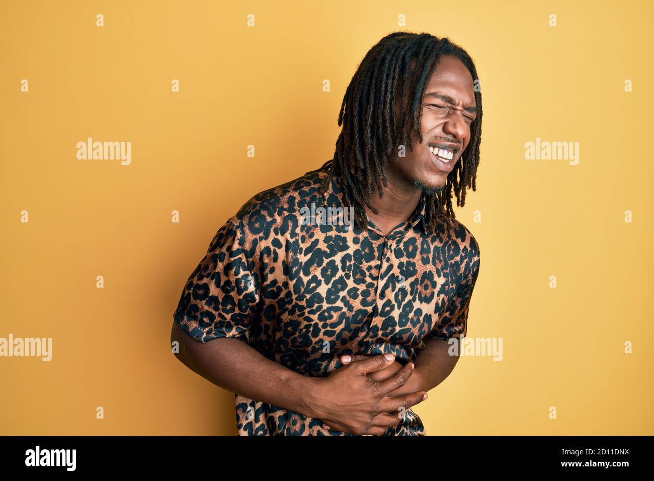 African american man with braids wearing leopard animal print shirt ...