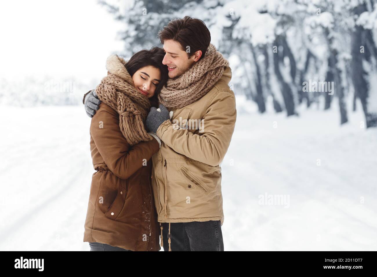 Sweet Couple Hugging Standing In Snowy Forest Walking Outdoor Stock ...