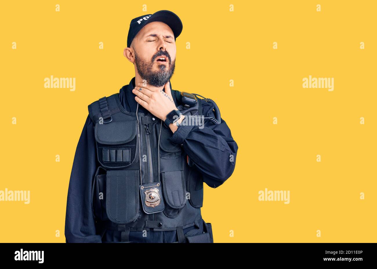 Young handsome man wearing police uniform touching painful neck, sore ...