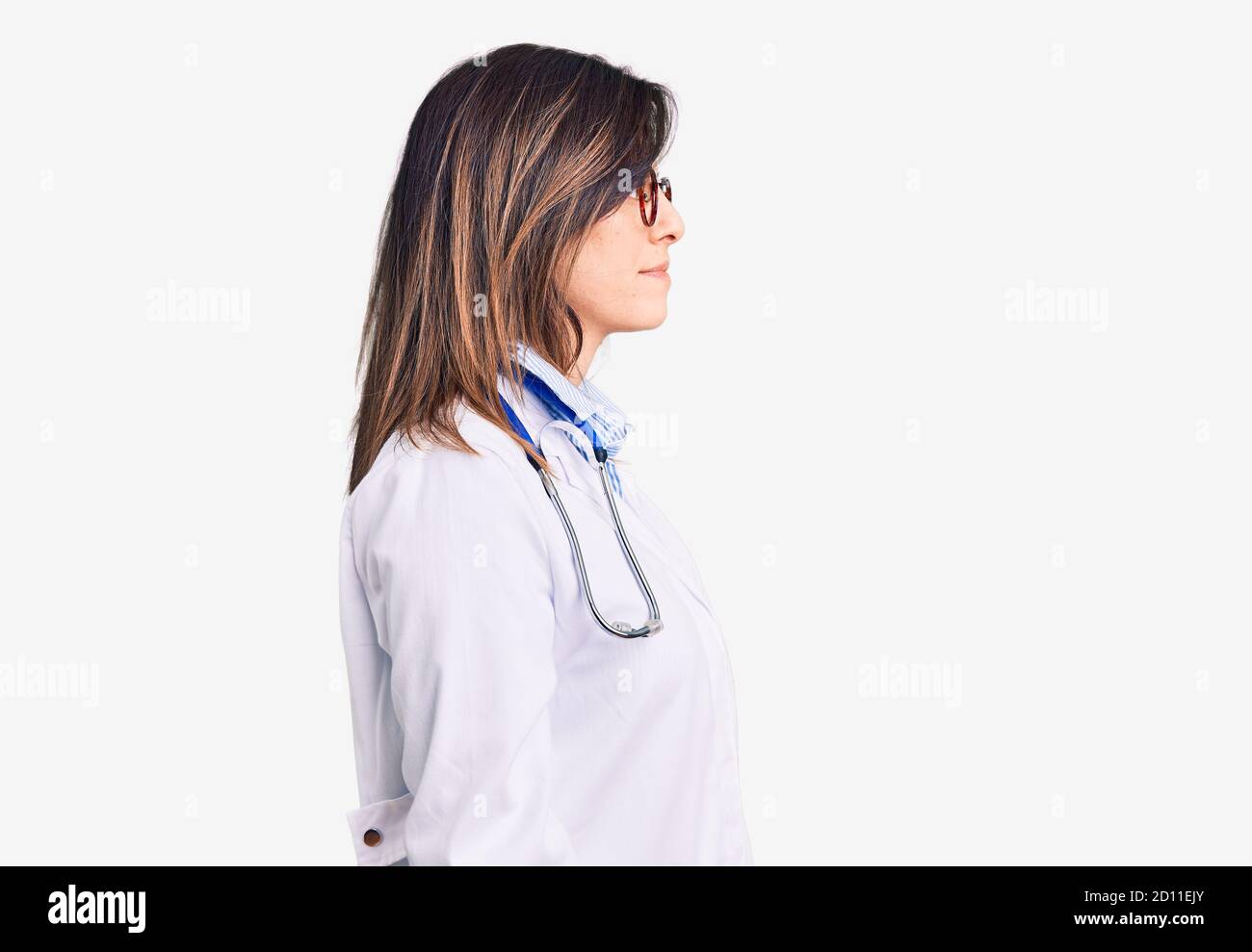 Young beautiful woman wearing doctor stethoscope and glasses looking to ...