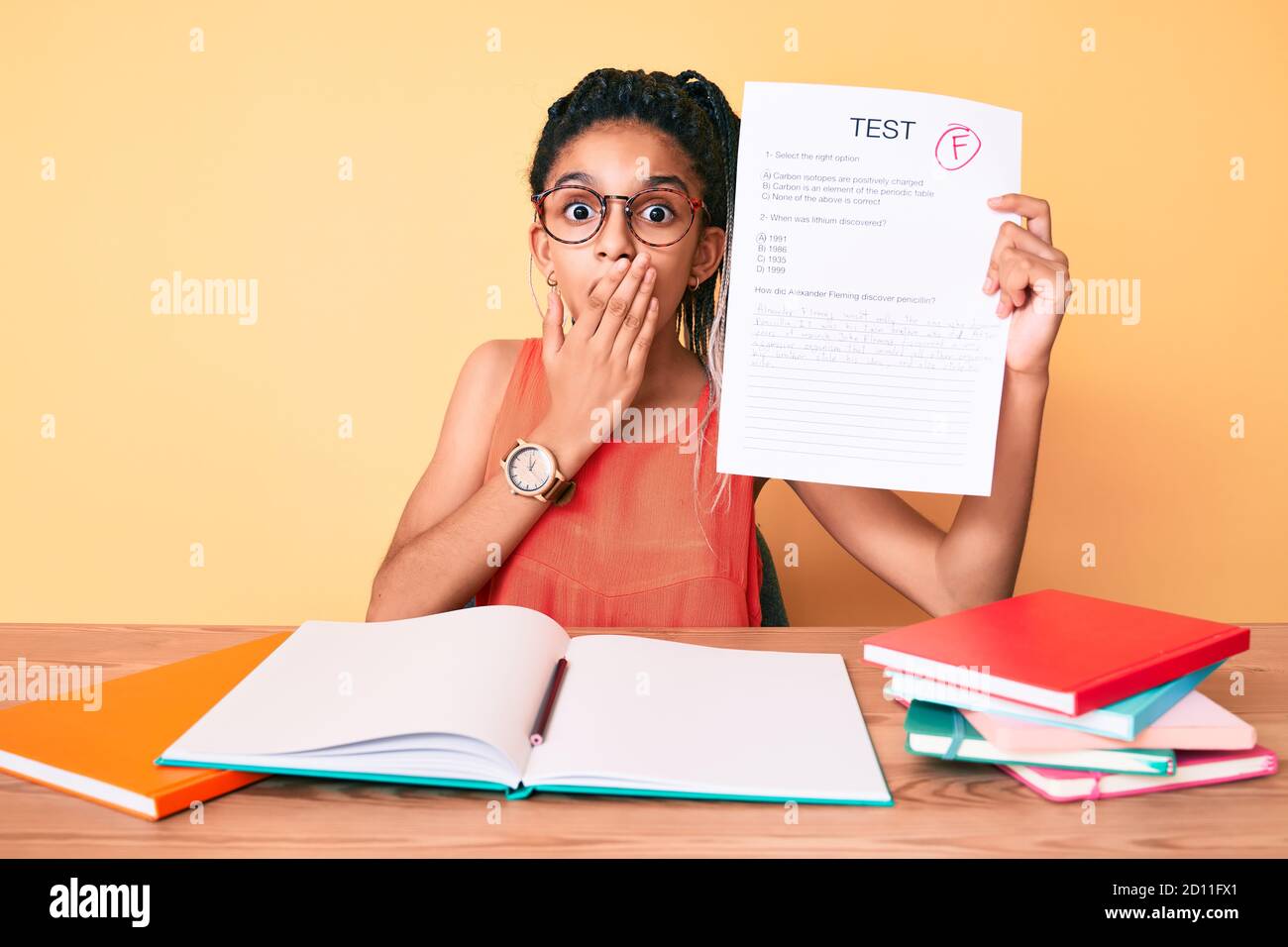 Young african american girl child with braids showing failed exam ...
