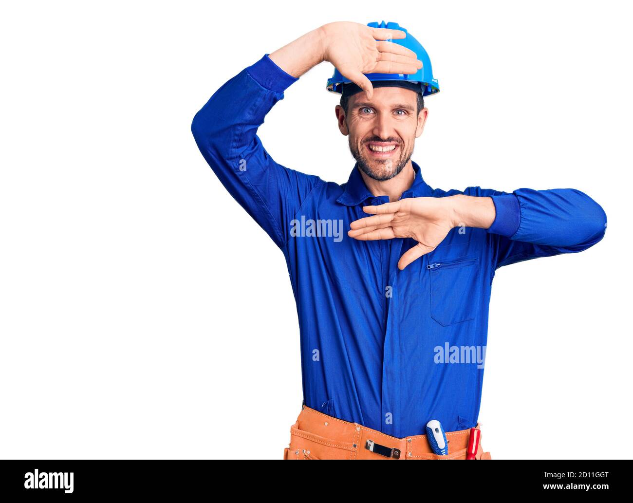 Young handsome man wearing worker uniform and hardhat smiling cheerful ...