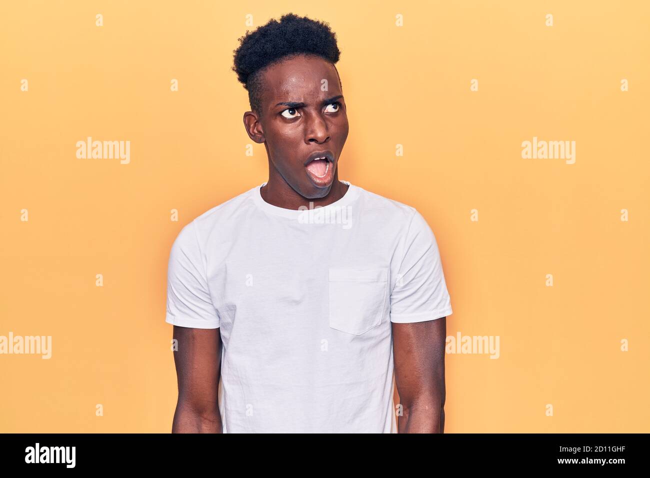 Young african american man wearing casual clothes angry and mad ...