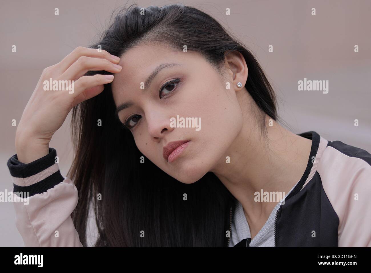 Pretty Asian girl in a city - close up shot Stock Photo - Alamy