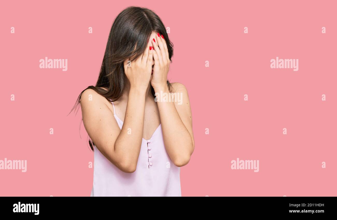 Young beautiful caucasian girl wearing casual clothes with sad ...