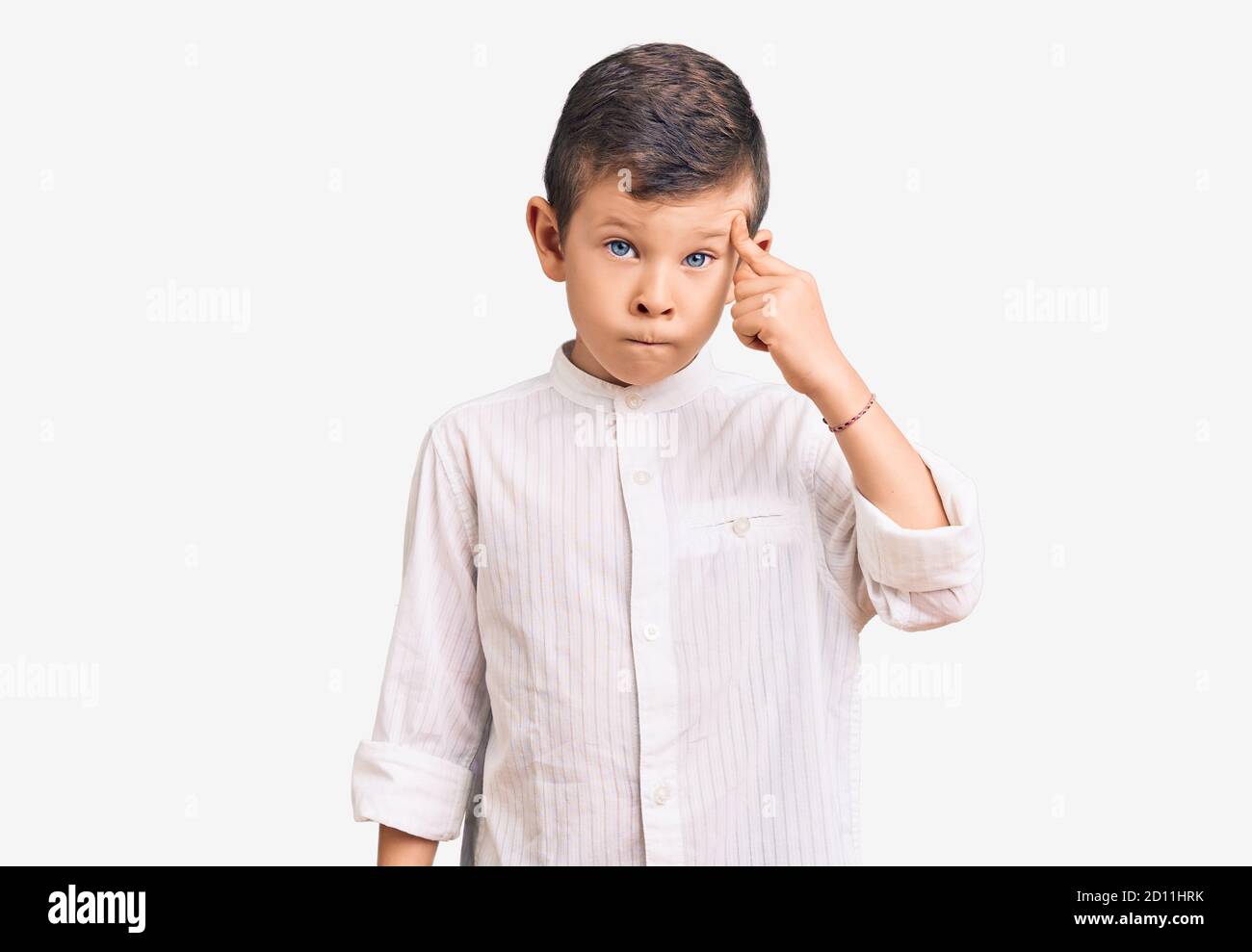 Cute blond kid wearing elegant shirt pointing unhappy to pimple on ...