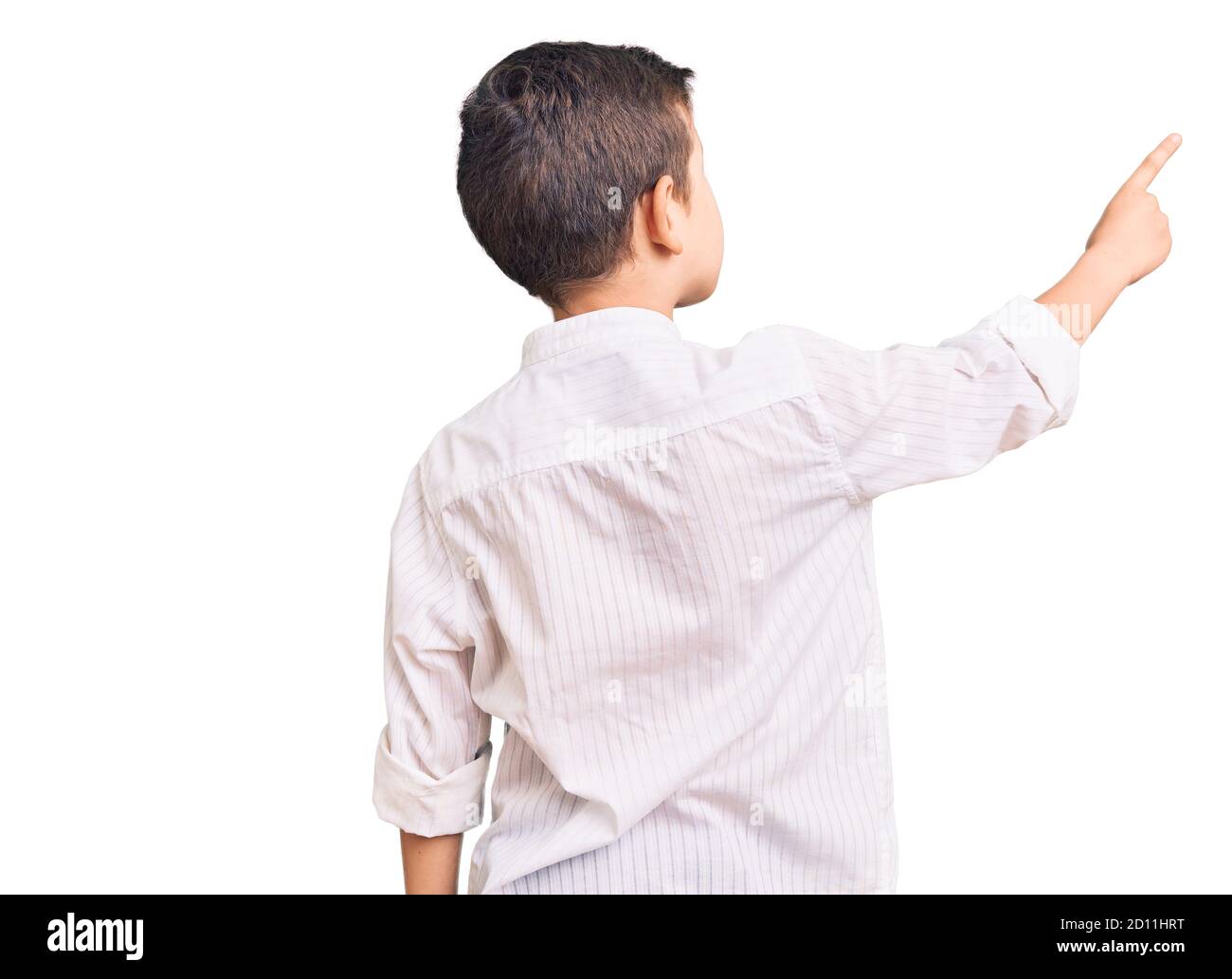 Cute blond kid wearing elegant shirt posing backwards pointing ahead ...