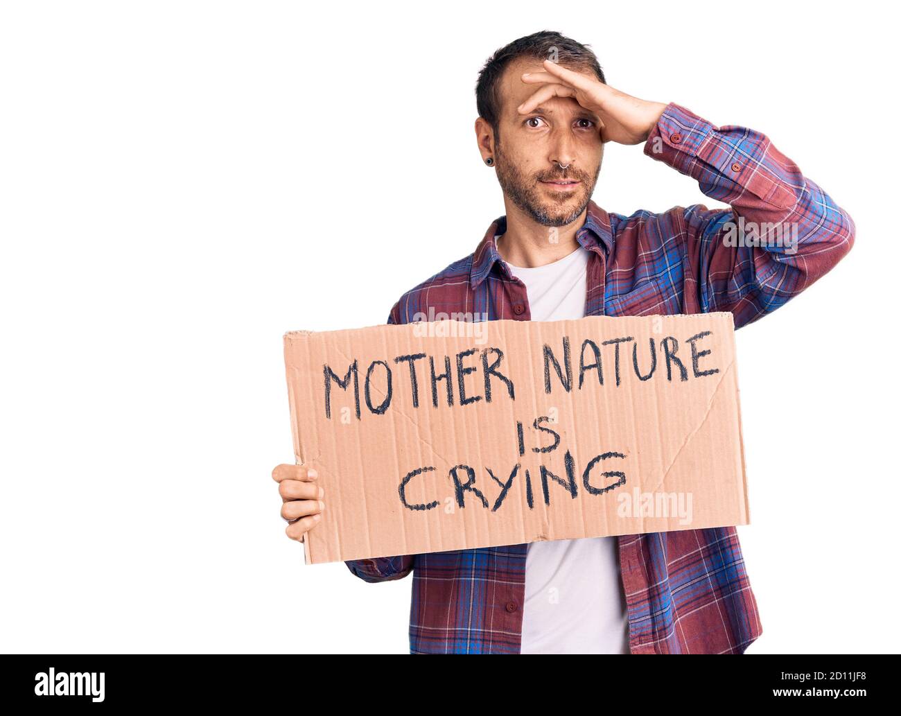 Young handsome man holding mother nature is crying protest cardboard ...