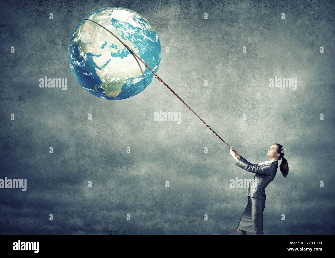 Woman catch Earth planet Stock Photo - Alamy