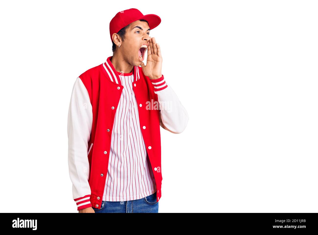 Young african amercian man wearing baseball uniform shouting and ...