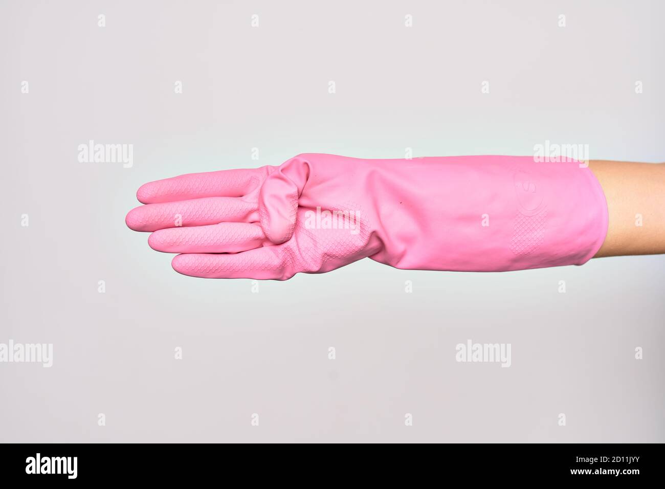 Hand of caucasian young woman wearing pink cleaning glove. Showing ...