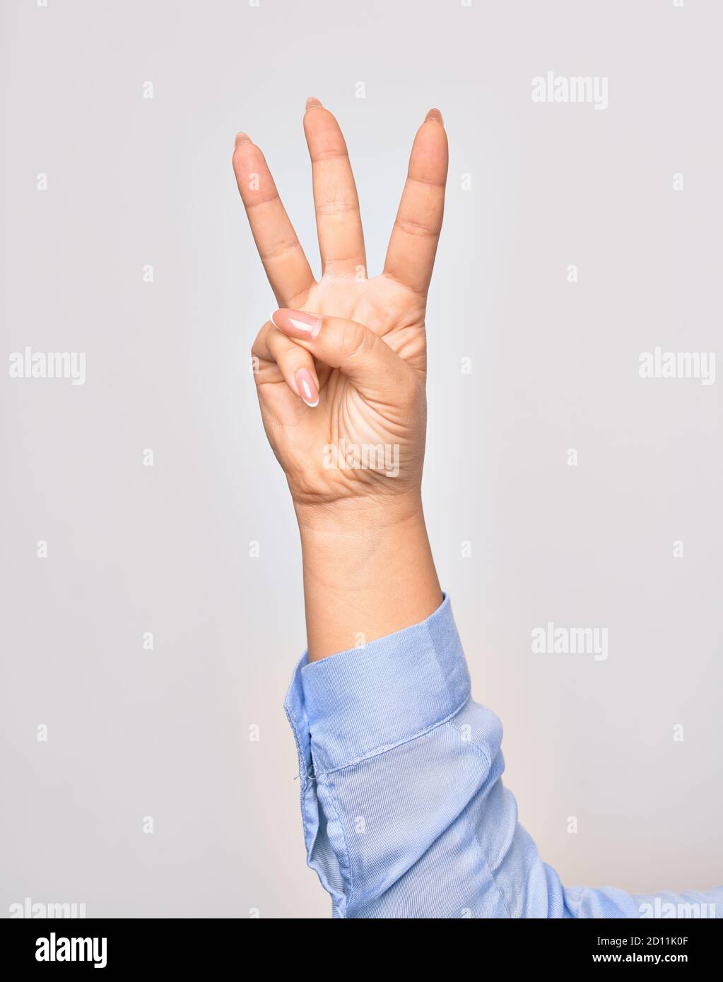 Hand of caucasian young woman showing number three with streched ...