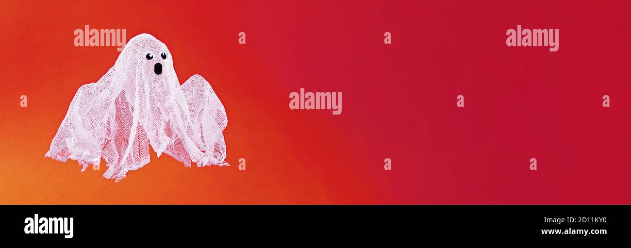 Diy Halloween ghost of starch and gauze on orange background. Gift idea ...