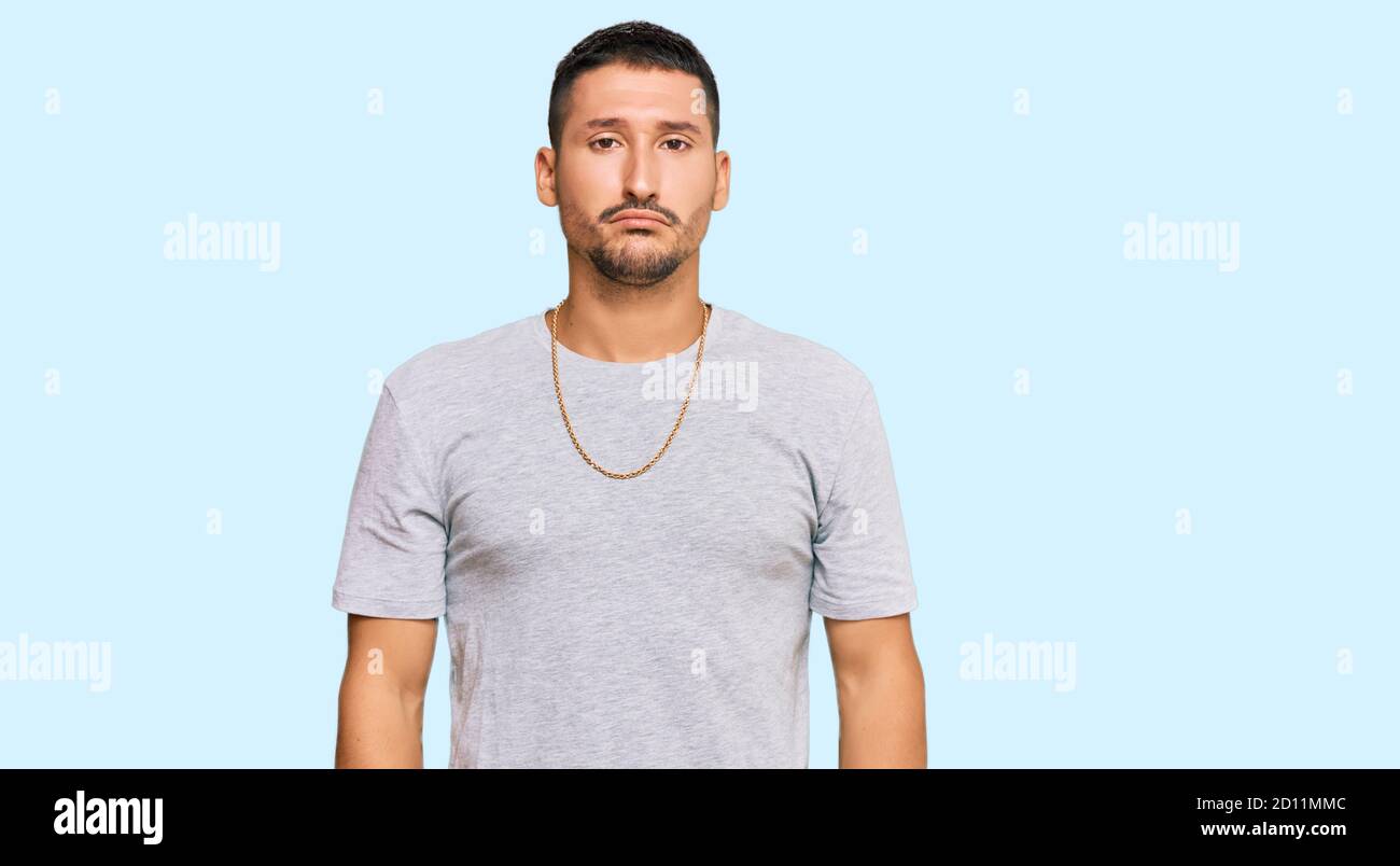 Handsome man with tattoos wearing 90s style depressed and worry for ...