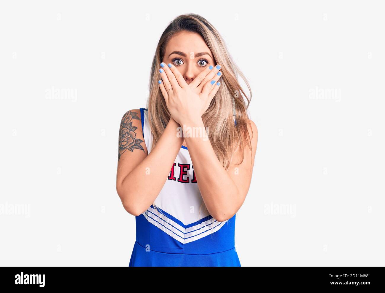 Young Beautiful Blonde Woman Wearing Cheerleader Uniform Shocked