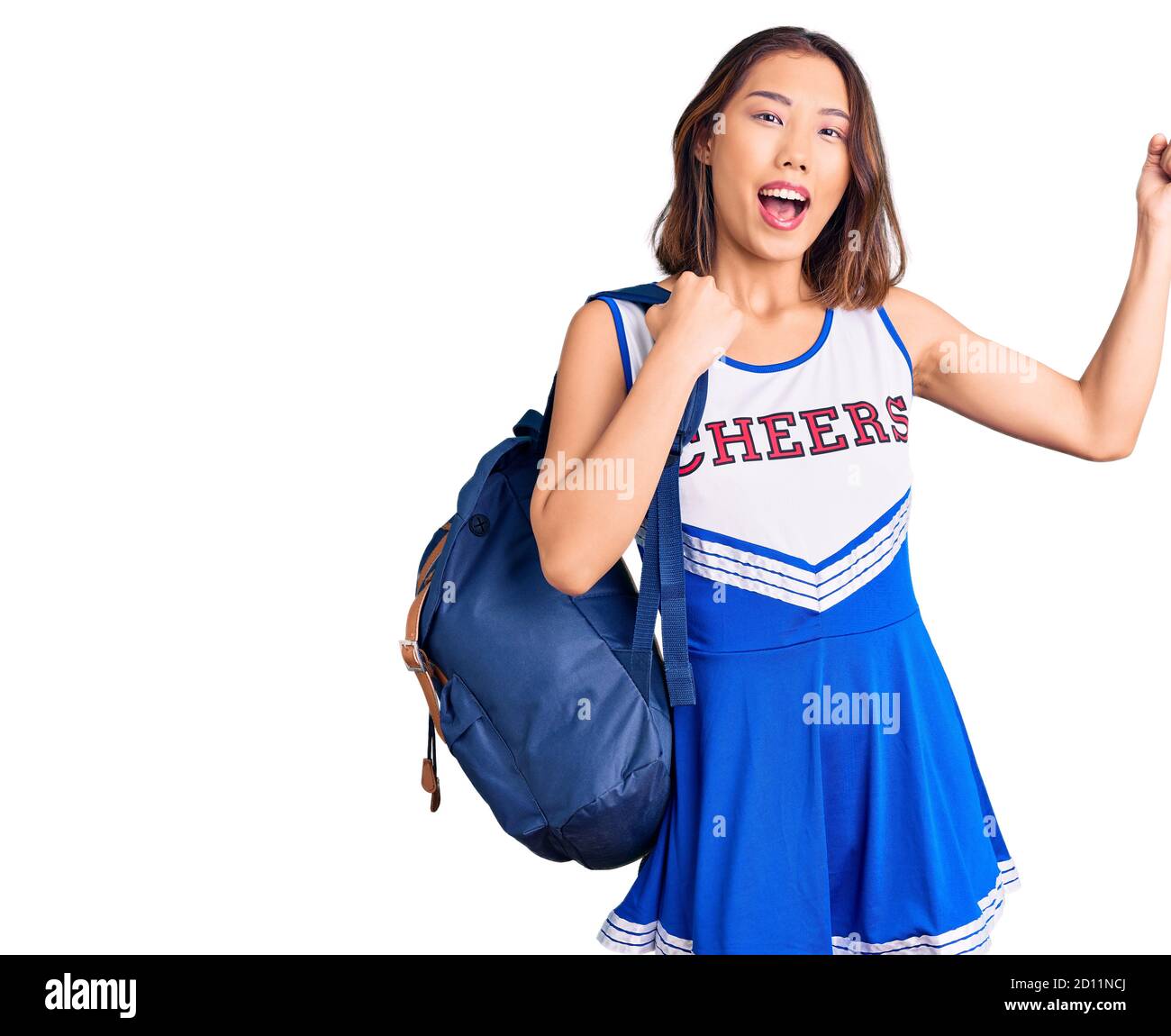 Young beautiful chinese girl wearing cheerleader uniform holding ...
