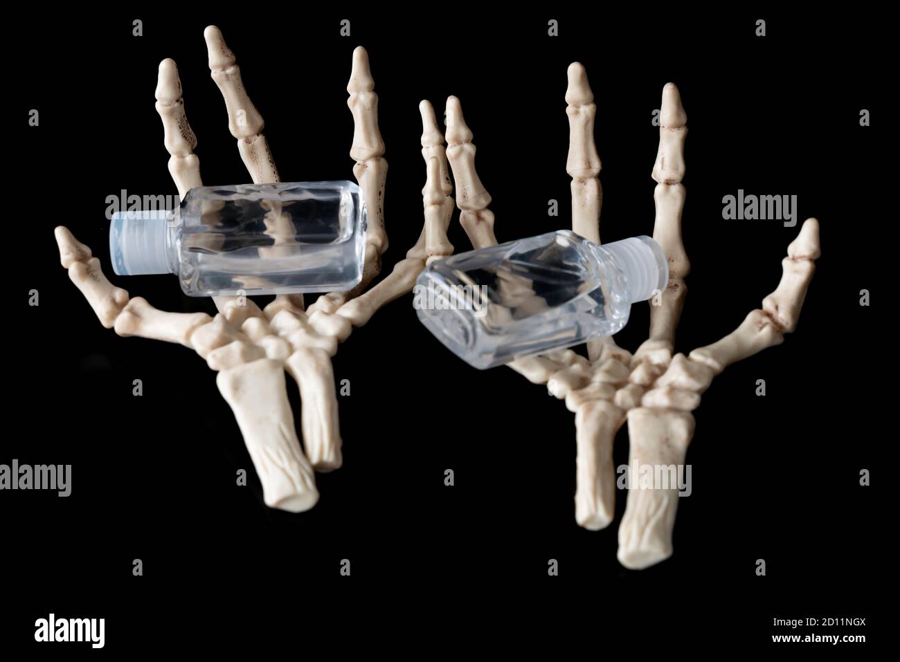 Skeleton Claw Hand holding bottles of Hand Sanitzer during Halloween ...