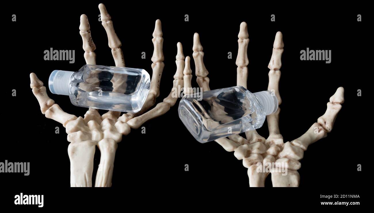 Skeleton Claw Hand holding bottles of Hand Sanitzer during Halloween ...