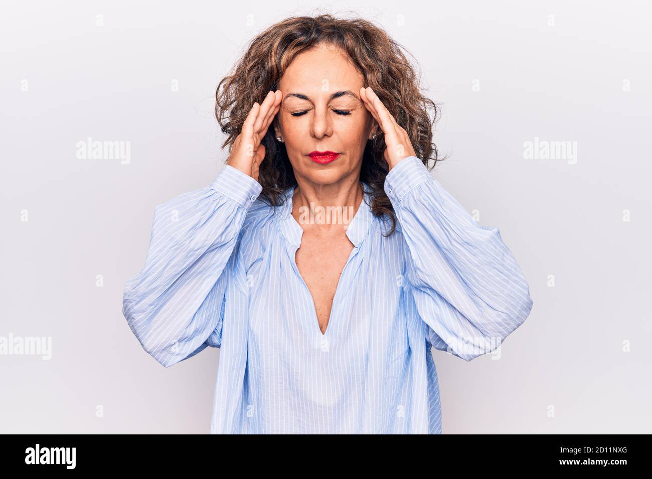 Middle Age Beautiful Brunette Woman Wearing Striped Shirt Standing Over