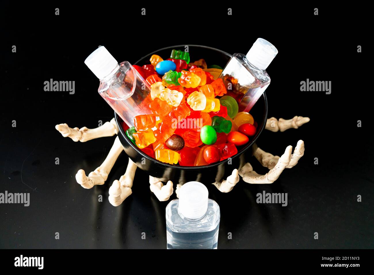 Skeleton Claw hands with Candy and Hand Sanitizer - Halloween Concept ...