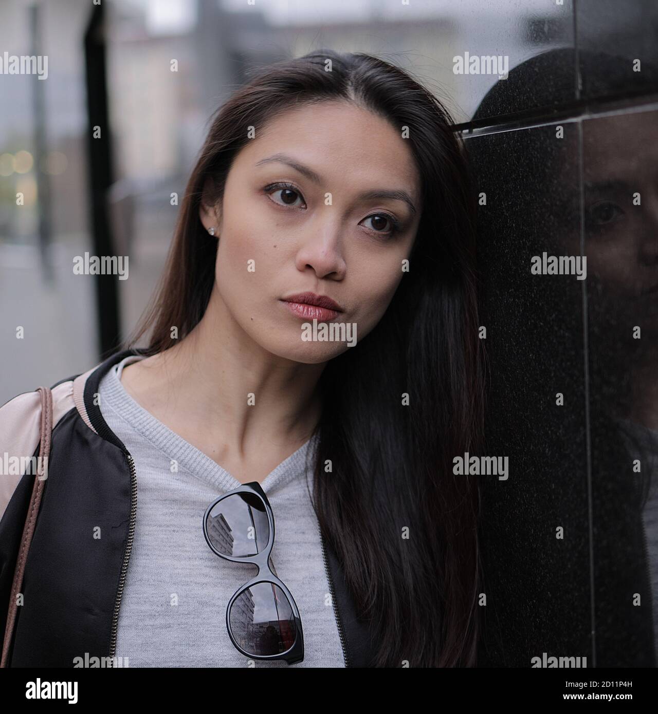 Pretty Asian girl in an urban aera Stock Photo - Alamy